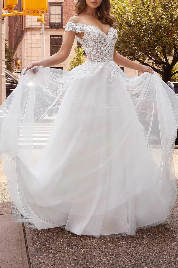 Off the shoulder lace decal with a simple white wedding dress paired w ...