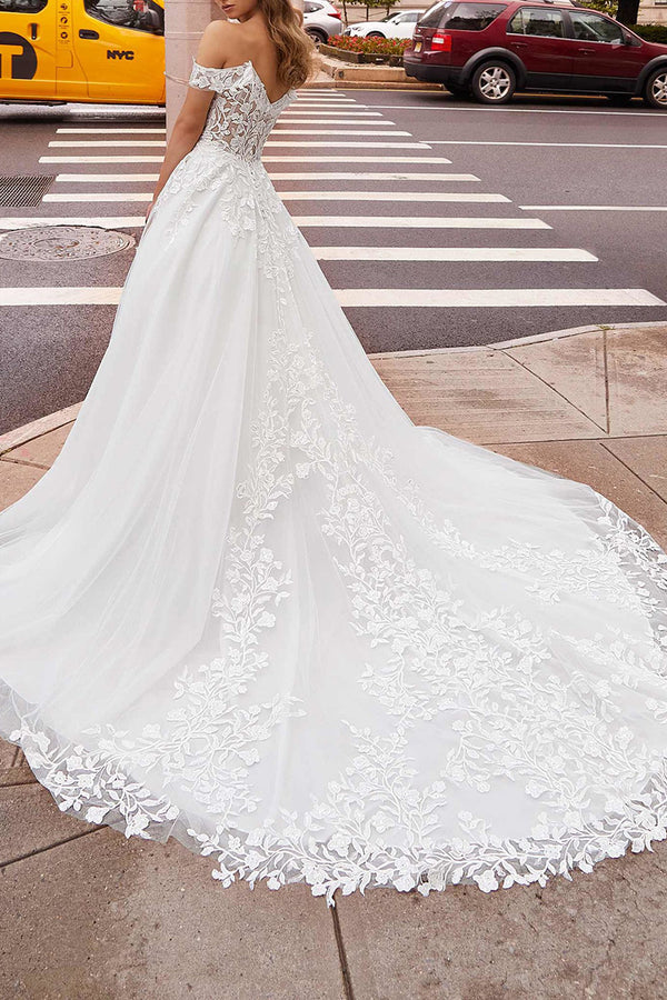 Off the shoulder lace decal with a simple white wedding dress paired w ...